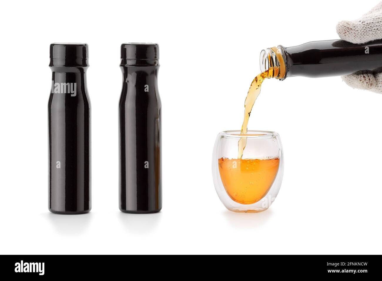 kombucha pouring in a double wall tea glass Stock Photo - Alamy