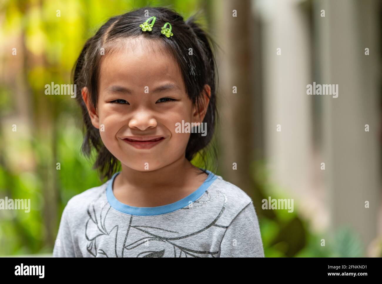 Portrait cute little girl in a garden Stock Photo - Alamy Portrait cute little girl in a garden Stock Photo - Alamy