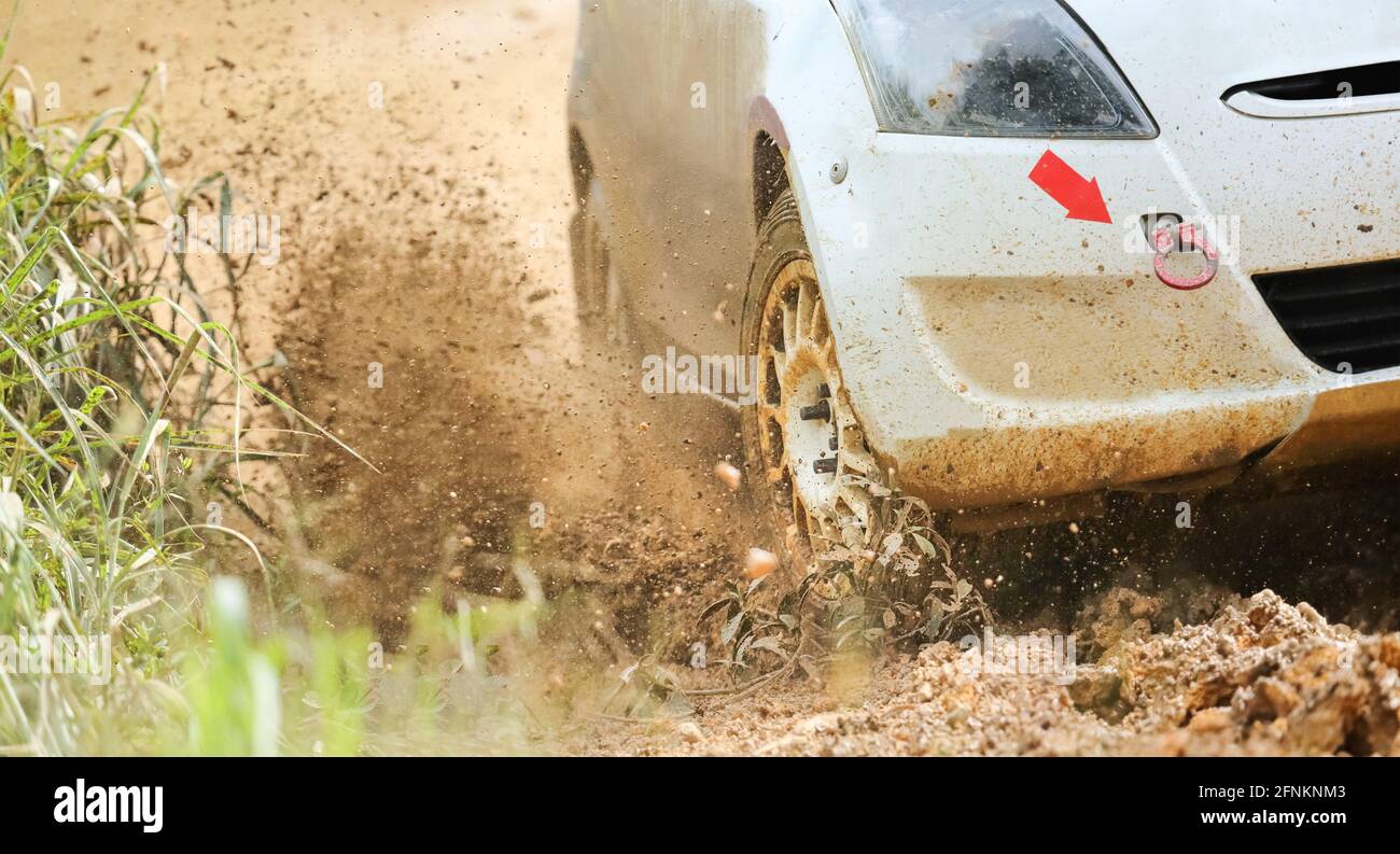 Rally car in muddy road Stock Photo - Alamy