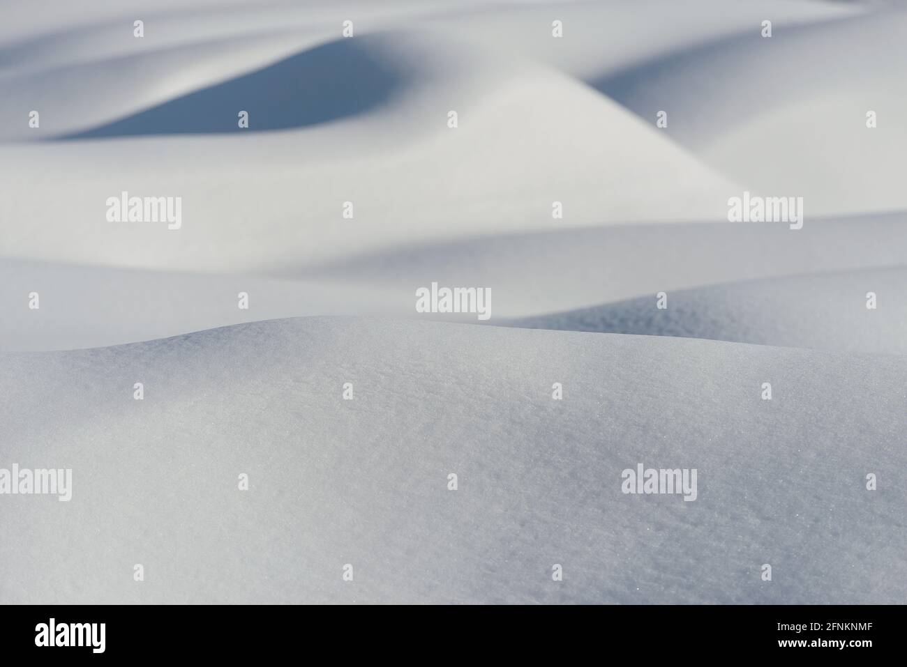 Snow shapes in Alaska. Light and shadows Stock Photo - Alamy