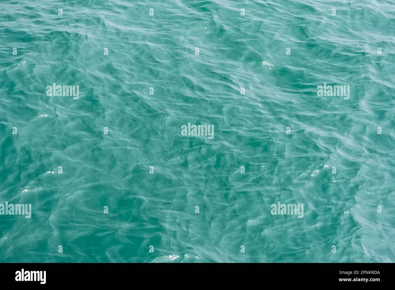 A close-up of the ocean wave surface wallpaper in the sunlight Stock ...