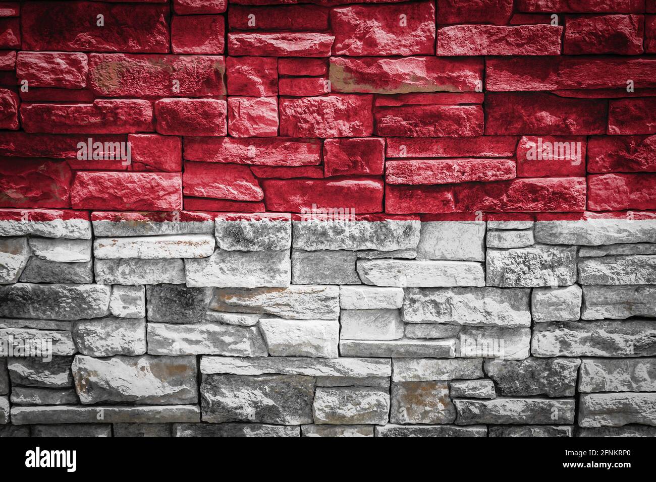 National flag of Indonesia on stone wall background.The concept of ...