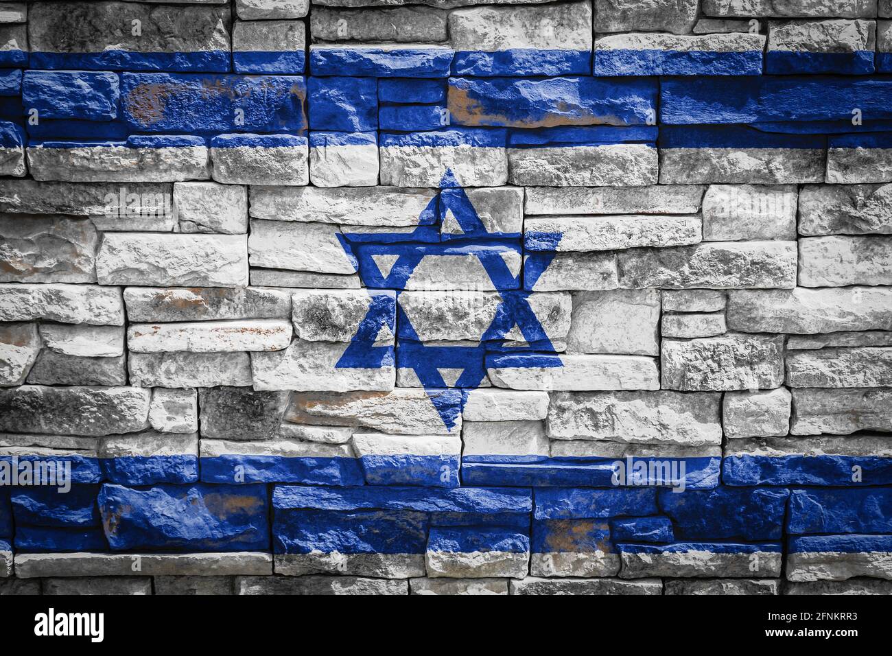 National flag of Israel on stone wall background.The concept of ...