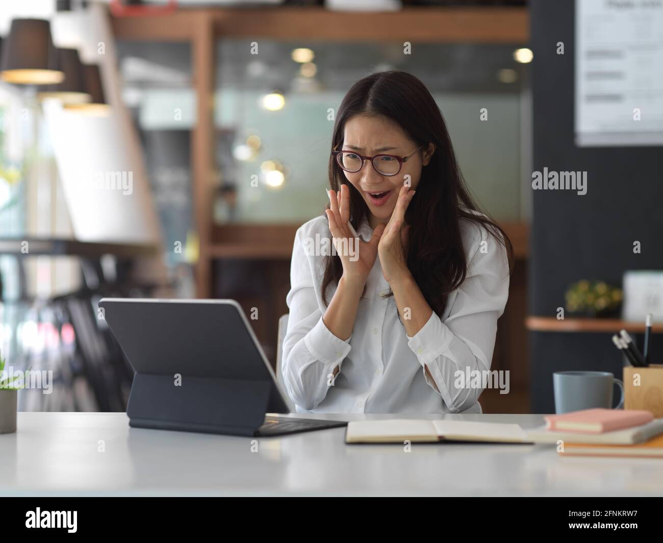 Cheerful female office worker hi-res stock photography and images - Alamy
