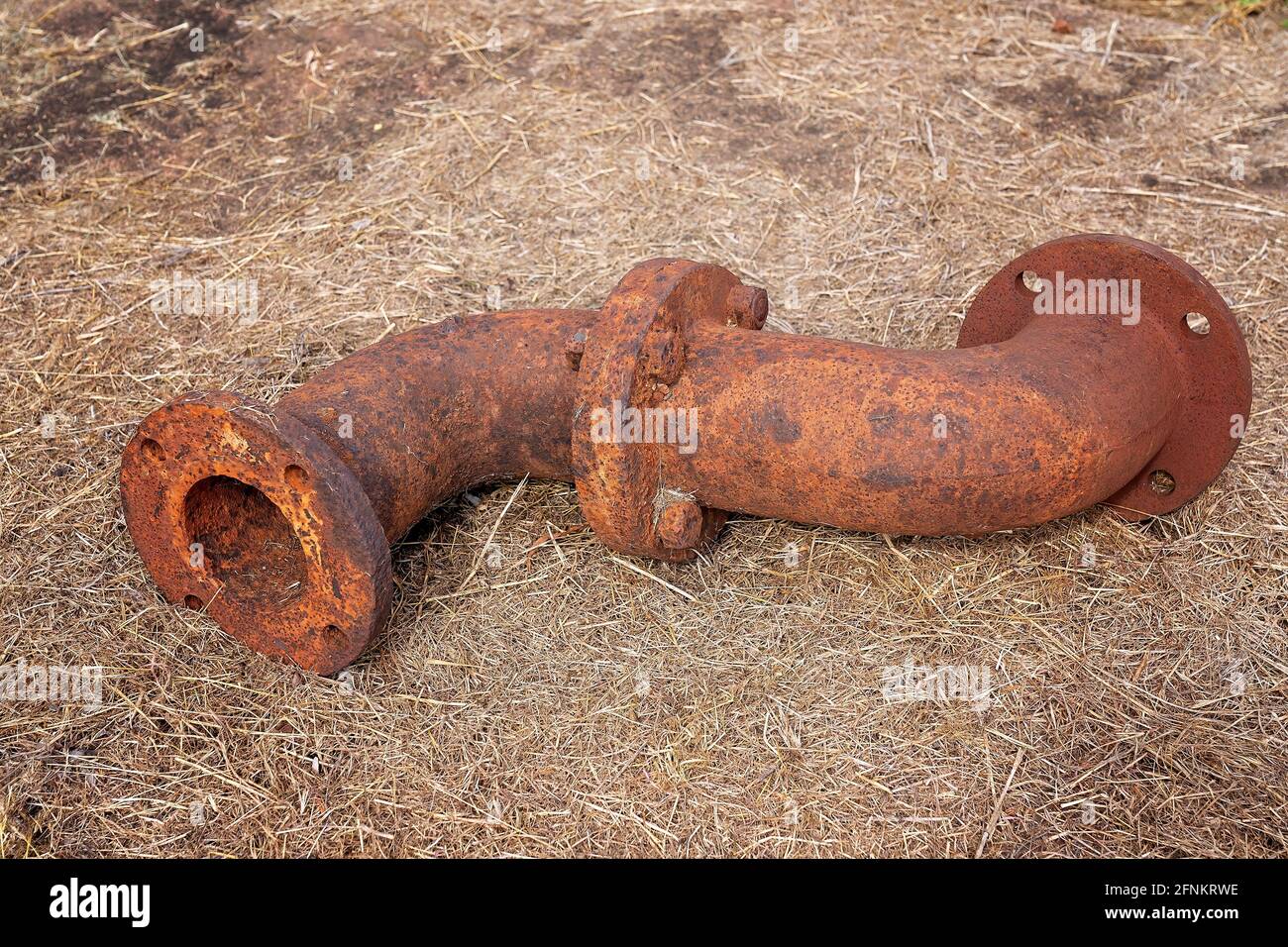 Old rusted cast iron elbow pipes Stock Photo - Alamy