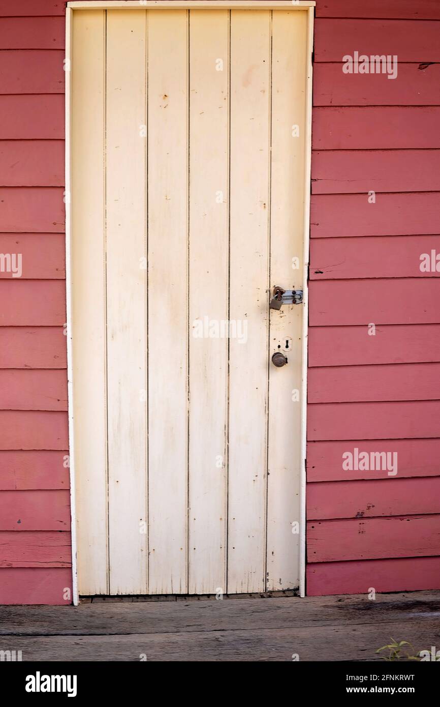 An old white door in an old pink wall, relics of a bygone era Stock ...