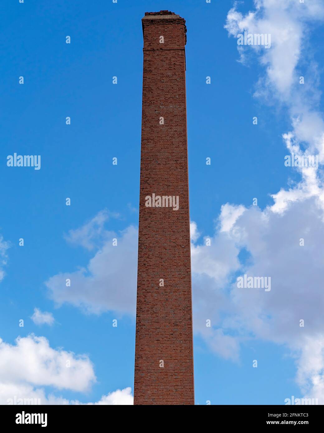 Close up of tall ancient chimney of Copperfield defunct copper refinery ...