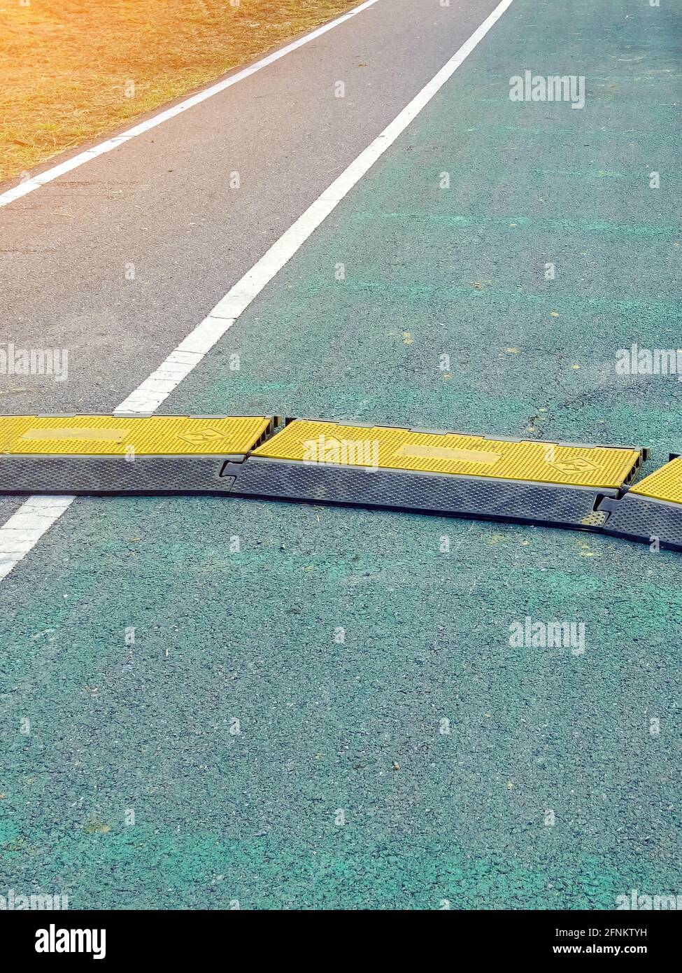 Black and yellow heavy plastic covers for people and vehicle to cross ...