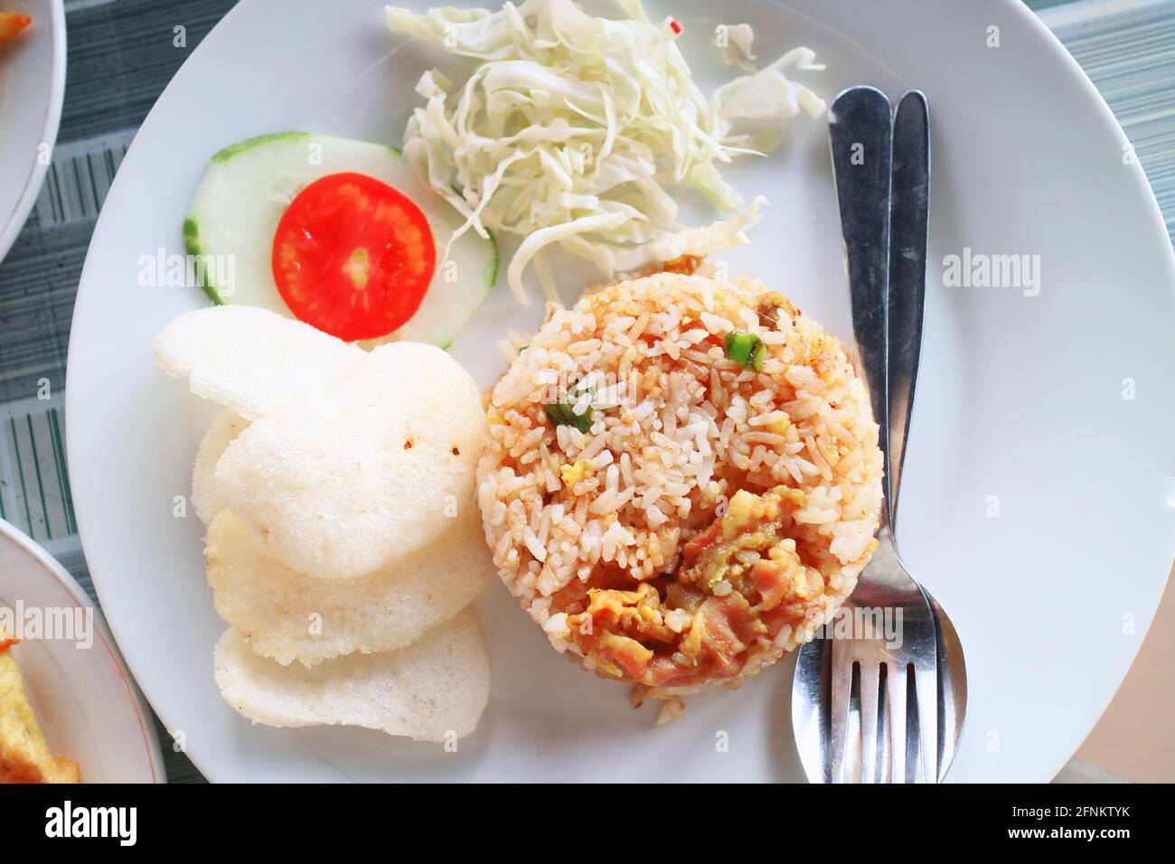 fried rice on a plate complete with crackers photo Stock Photo - Alamy