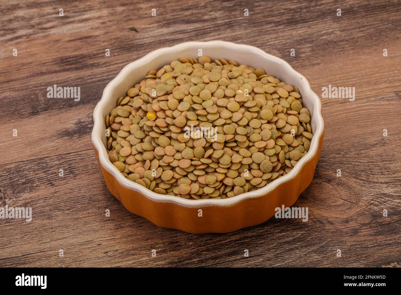 Vegan cuisine - Dry lentil heap isolated Stock Photo - Alamy