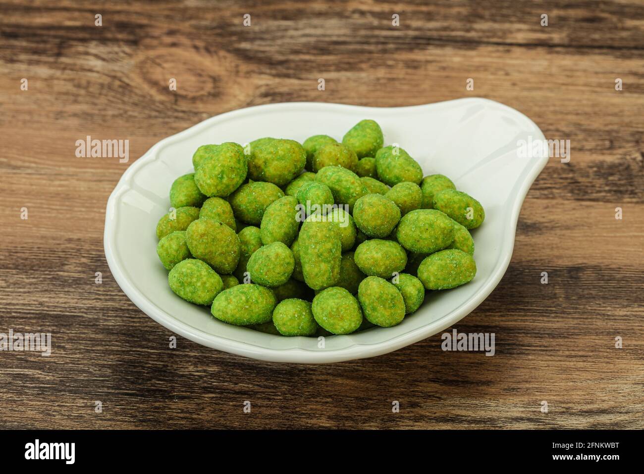 Spicy wasabi peanuts snack in the bowl Stock Photo - Alamy