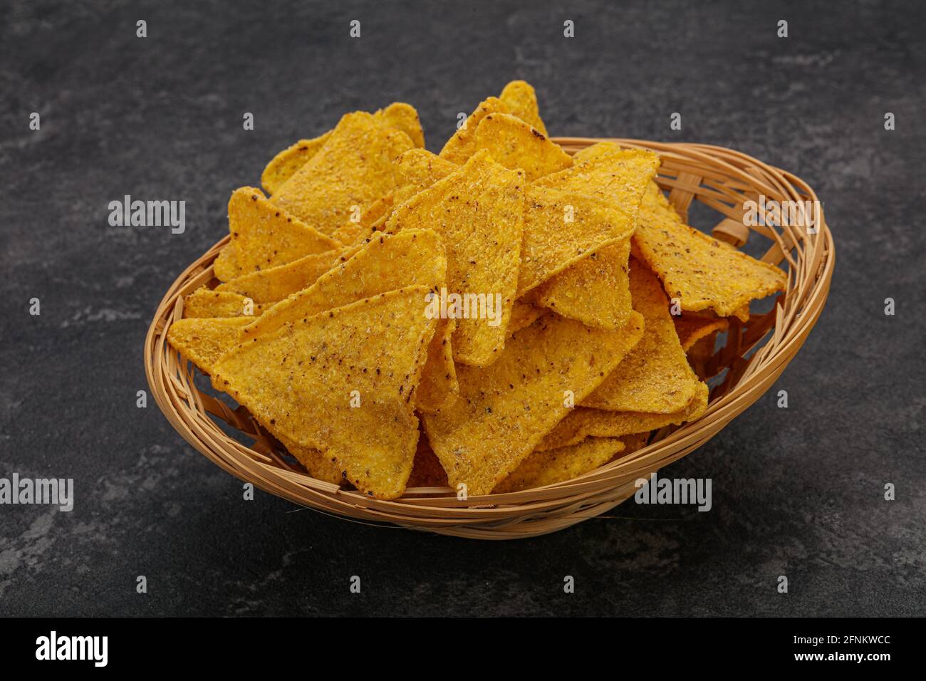Mexican crunchy corn nachos triangle heap Stock Photo - Alamy