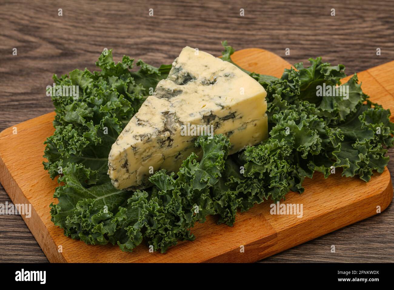 Dairy Blue cheese triangle with mold Stock Photo - Alamy