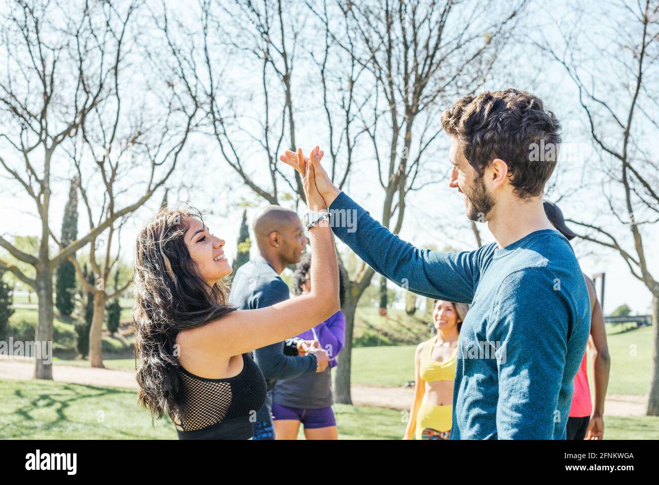 A girl and a boy runners hit the palms of their hands Stock Photo - Alamy