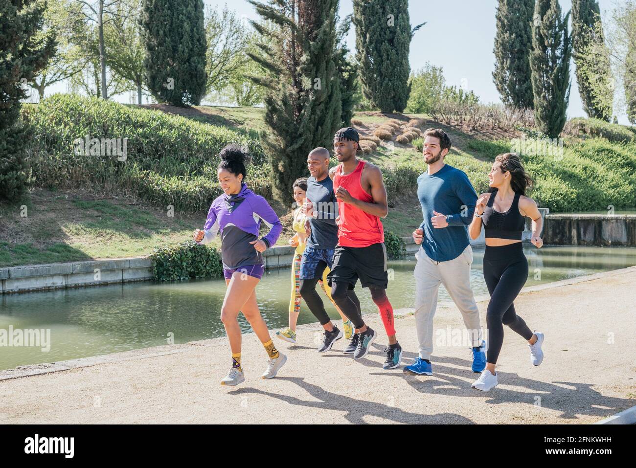 Athletic group people running park hi-res stock photography and images ...