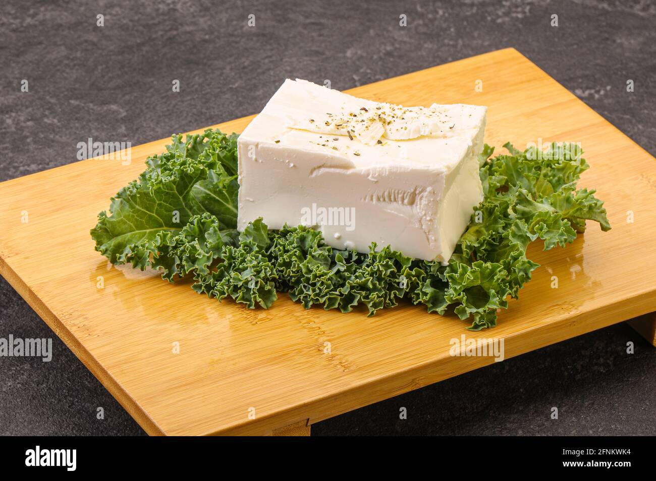Traditional tasty Greek Feta soft cheese brick Stock Photo - Alamy
