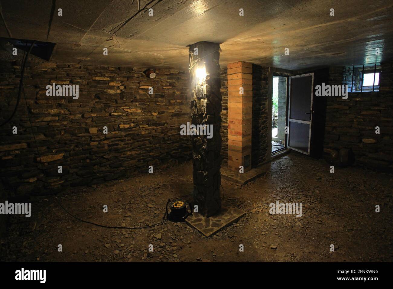 dark basement with stone wall Stock Photo - Alamy