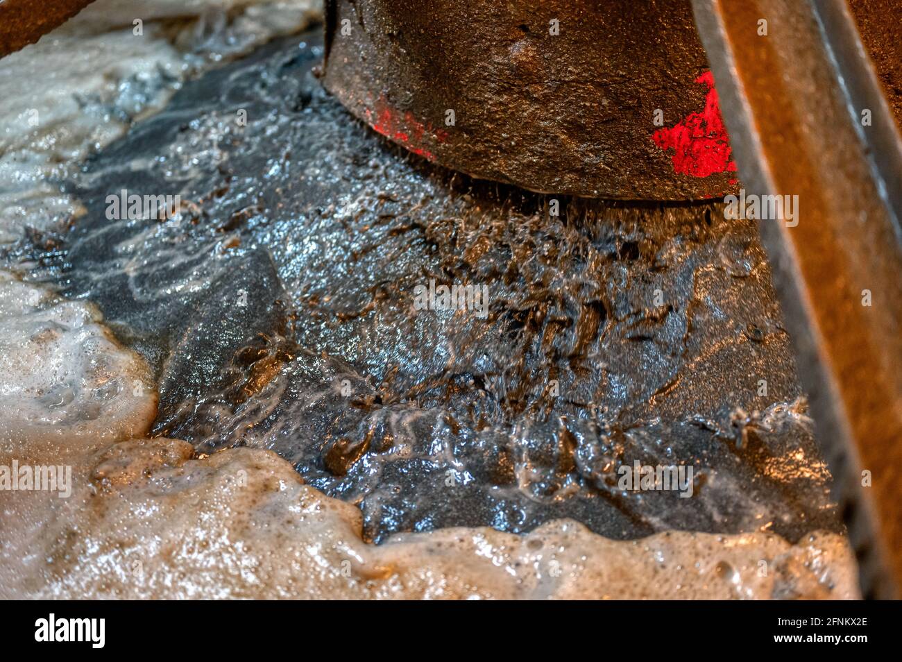 Industrial flotation process. Shooting close-up. The stream of liquid ...