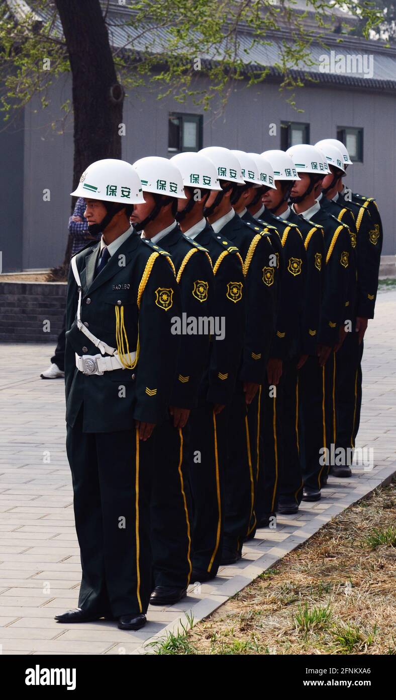 Chinese security forces standing in strait line during an order by ...