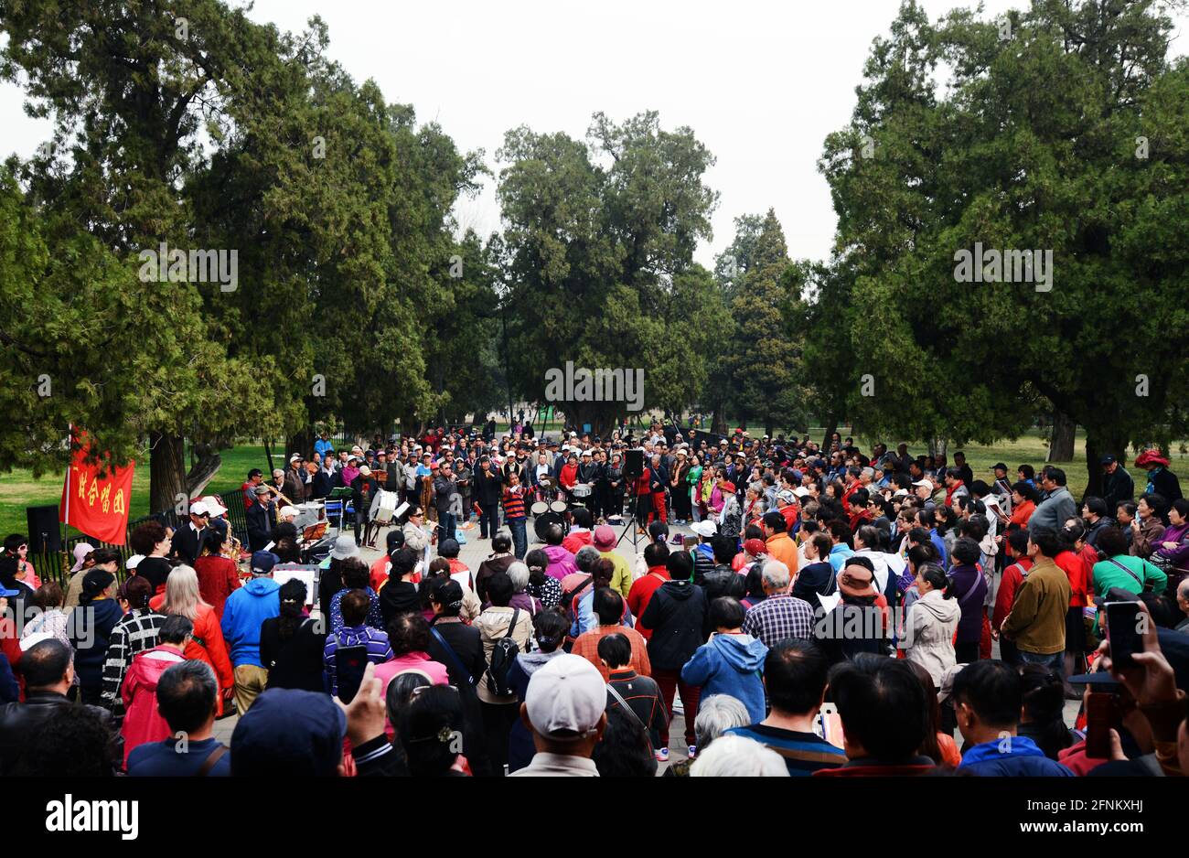 Chinese crowed enjoying a performance at the Temple of Heaven park in ...