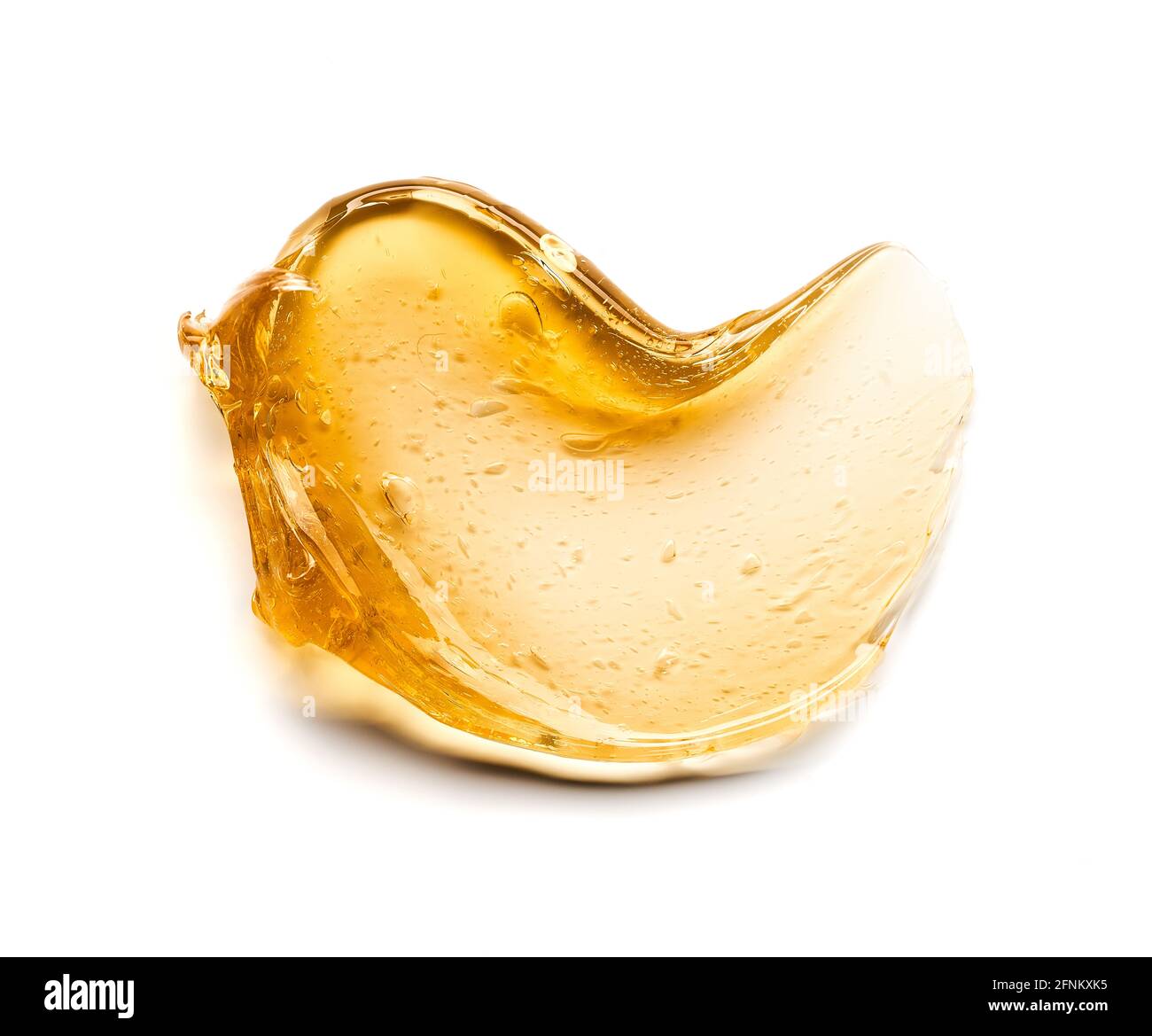 Transparent yellow smear of face cream or golden honey isolated on ...