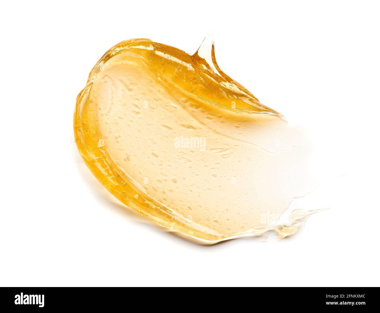 Transparent yellow smear of face cream or golden honey isolated on ...