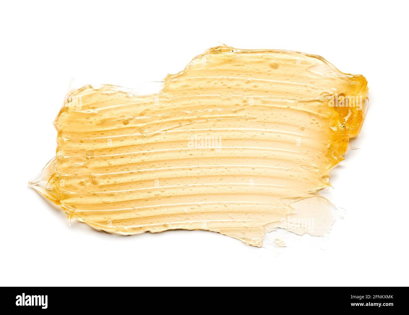 Transparent yellow smear of face cream or golden honey isolated on ...