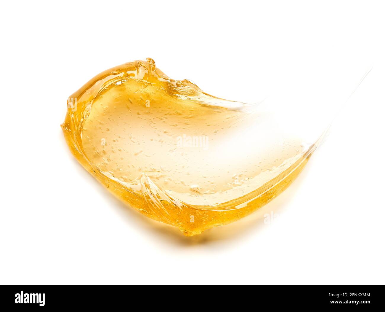Transparent yellow smear of face cream or golden honey isolated on ...