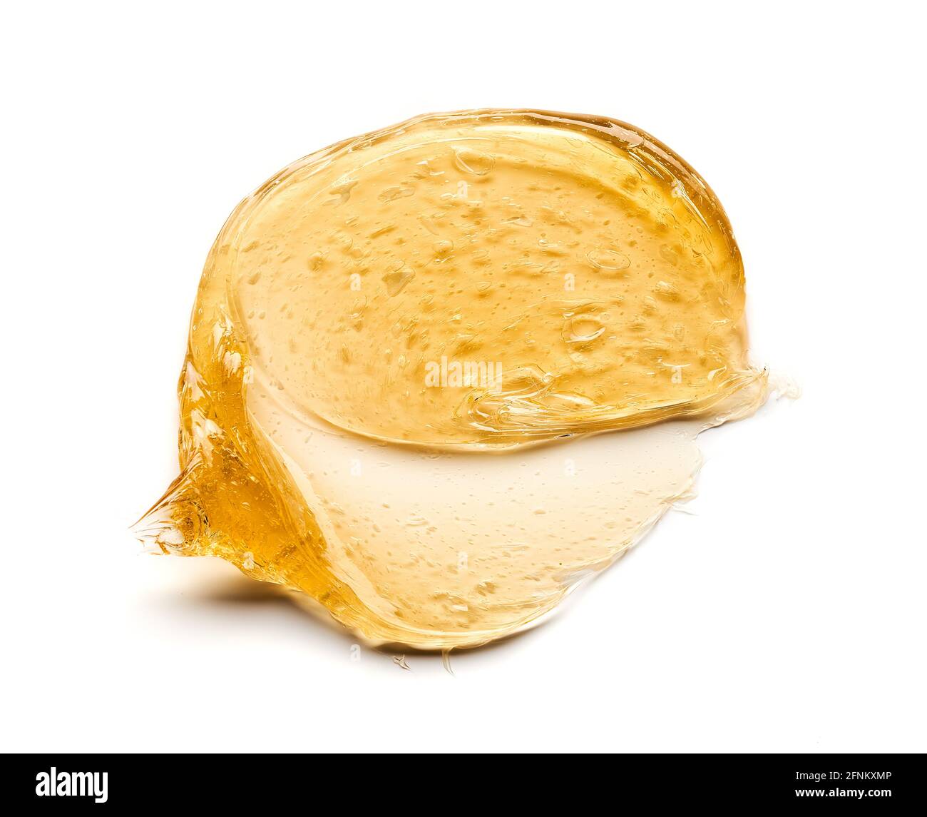 Transparent yellow smear of face cream or golden honey isolated on ...