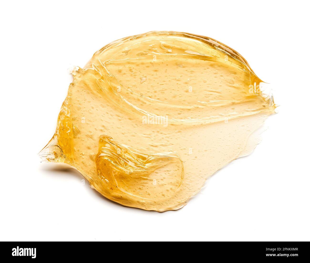 Transparent yellow smear of face cream or golden honey isolated on ...