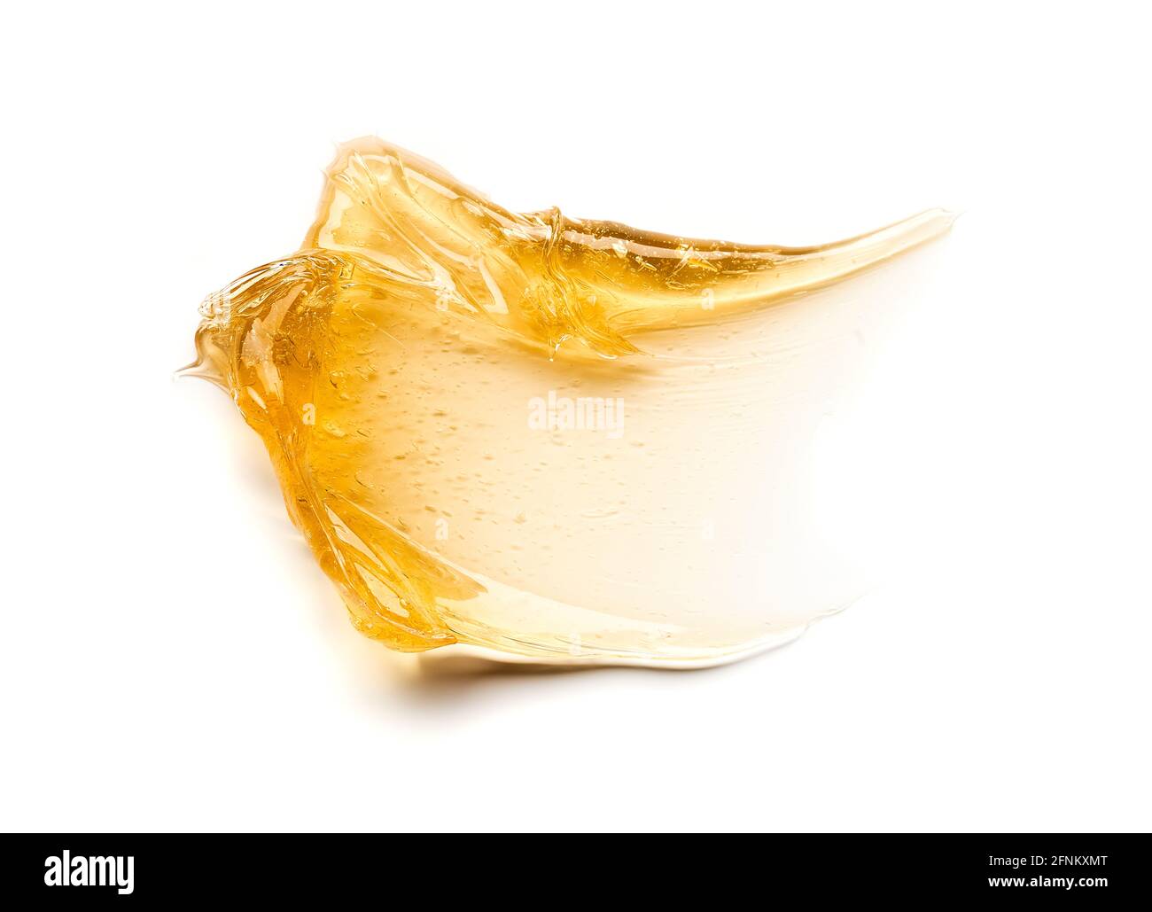 Transparent yellow smear of face cream or golden honey isolated on ...