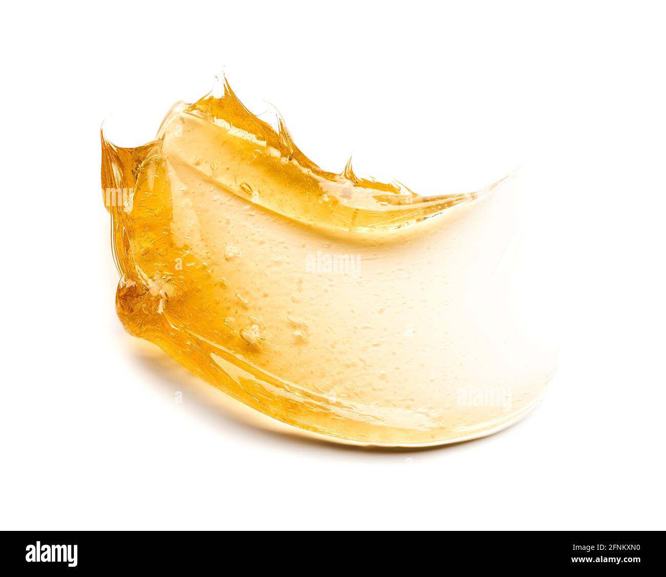 Transparent yellow smear of face cream or golden honey isolated on ...