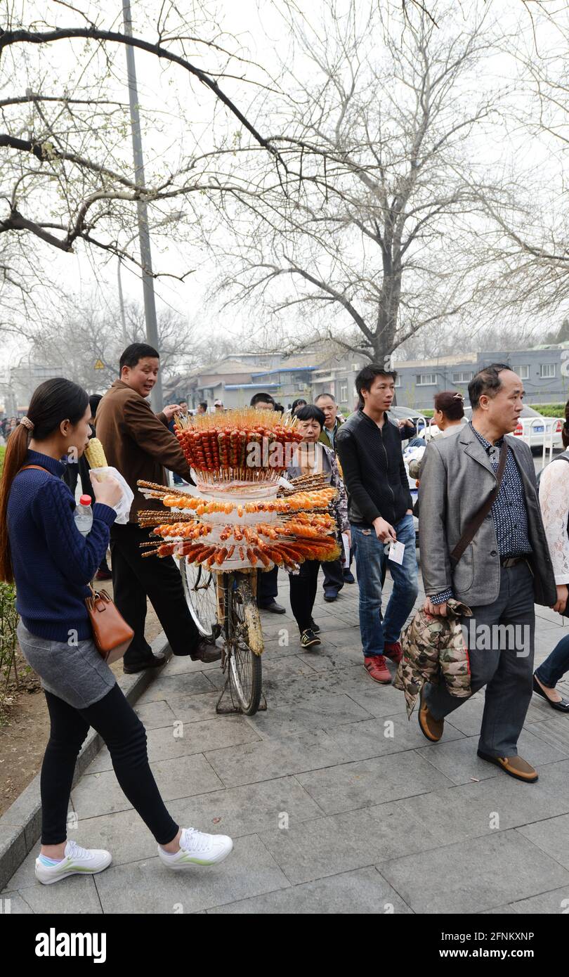 A Chinese candy vendor in Beijing, China Stock Photo - Alamy