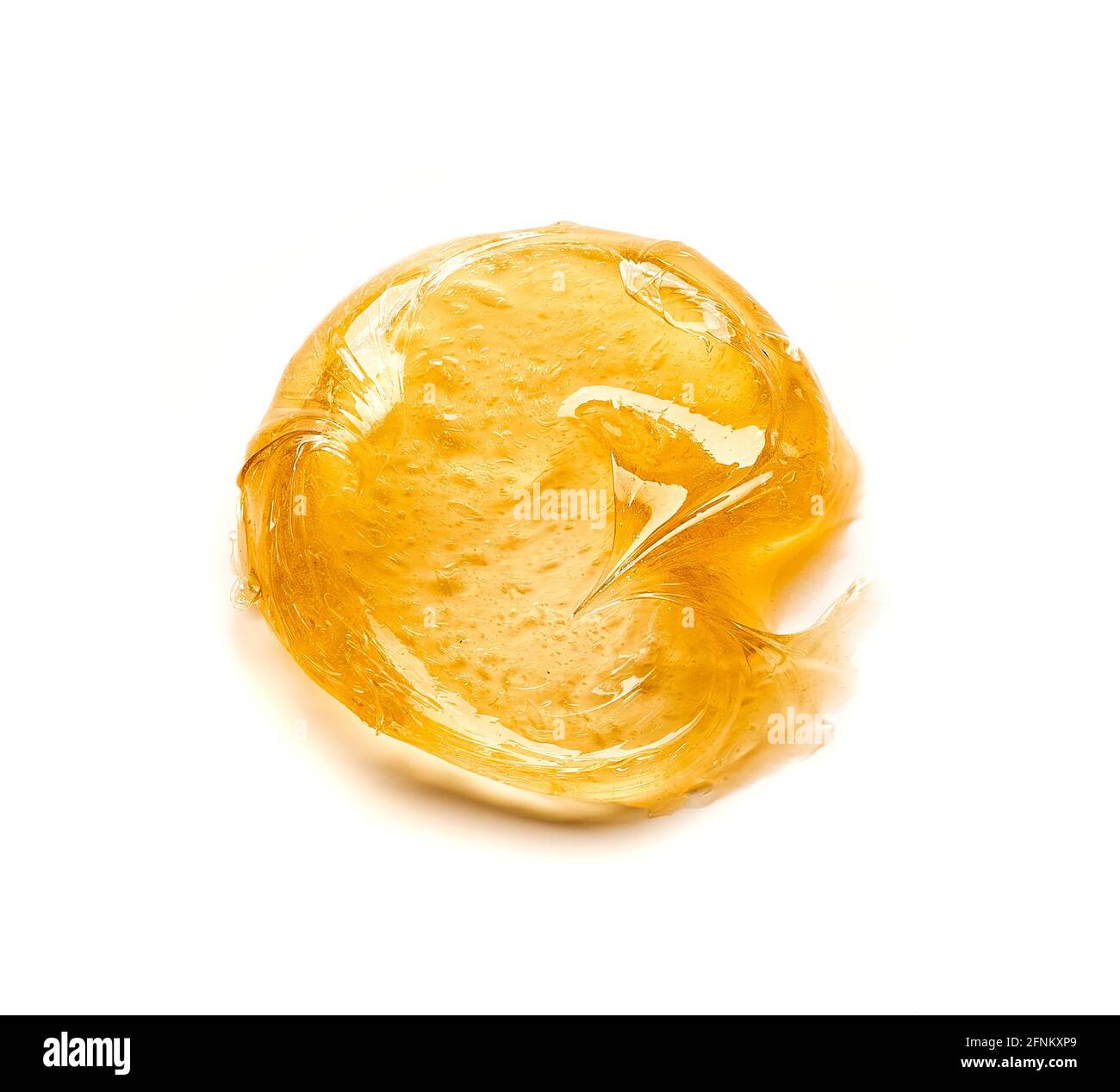 Transparent yellow smear of face cream or golden honey isolated on ...