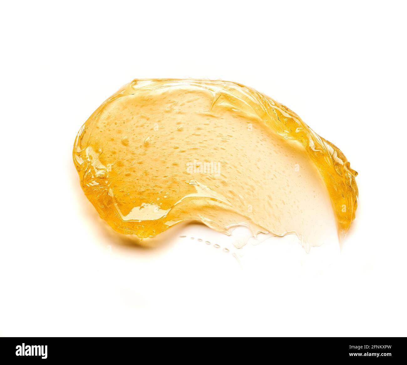 Transparent yellow smear of face cream or golden honey isolated on ...