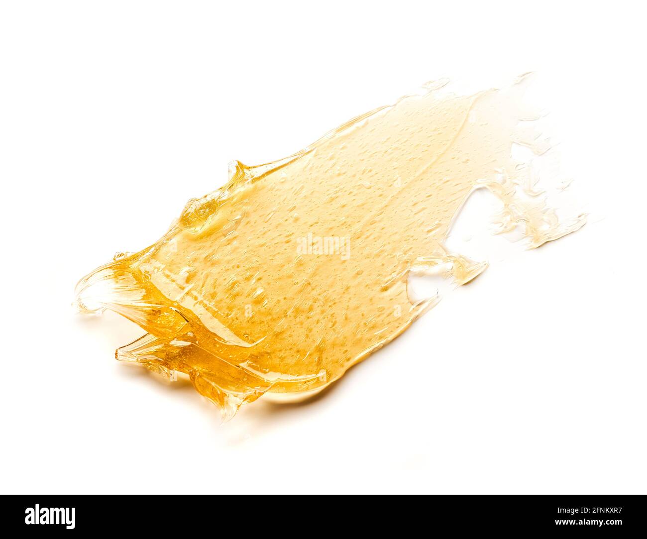 Transparent yellow smear of face cream or golden honey isolated on ...
