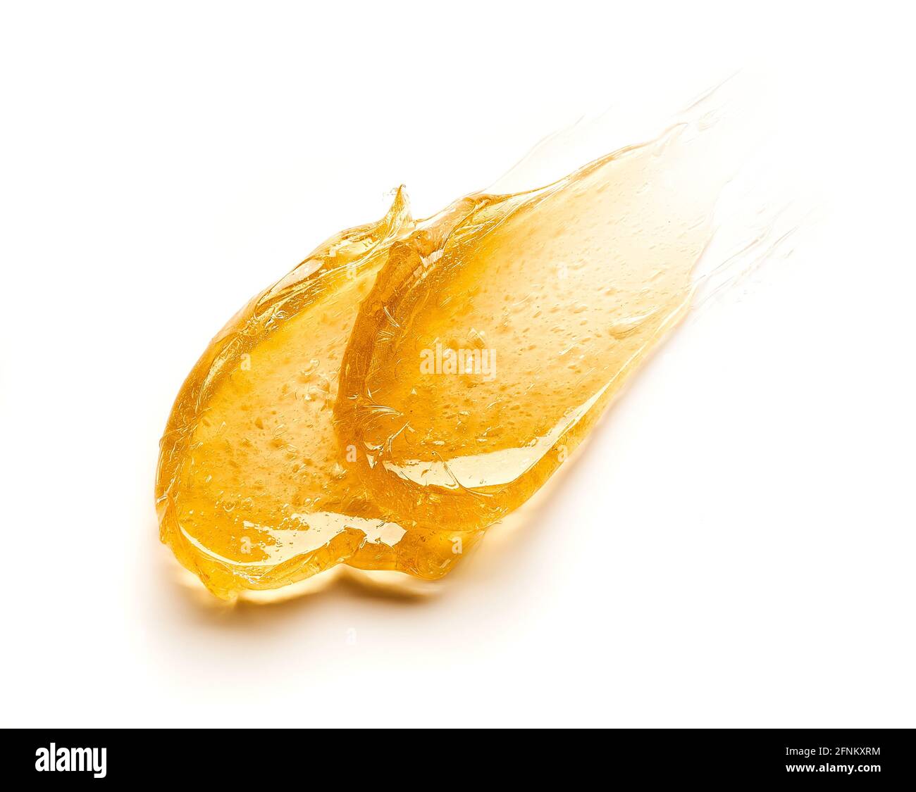 Transparent yellow smear of face cream or golden honey isolated on ...