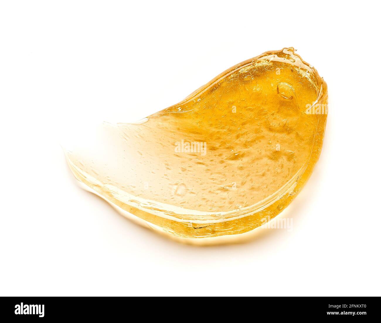 Transparent yellow smear of face cream or golden honey isolated on ...