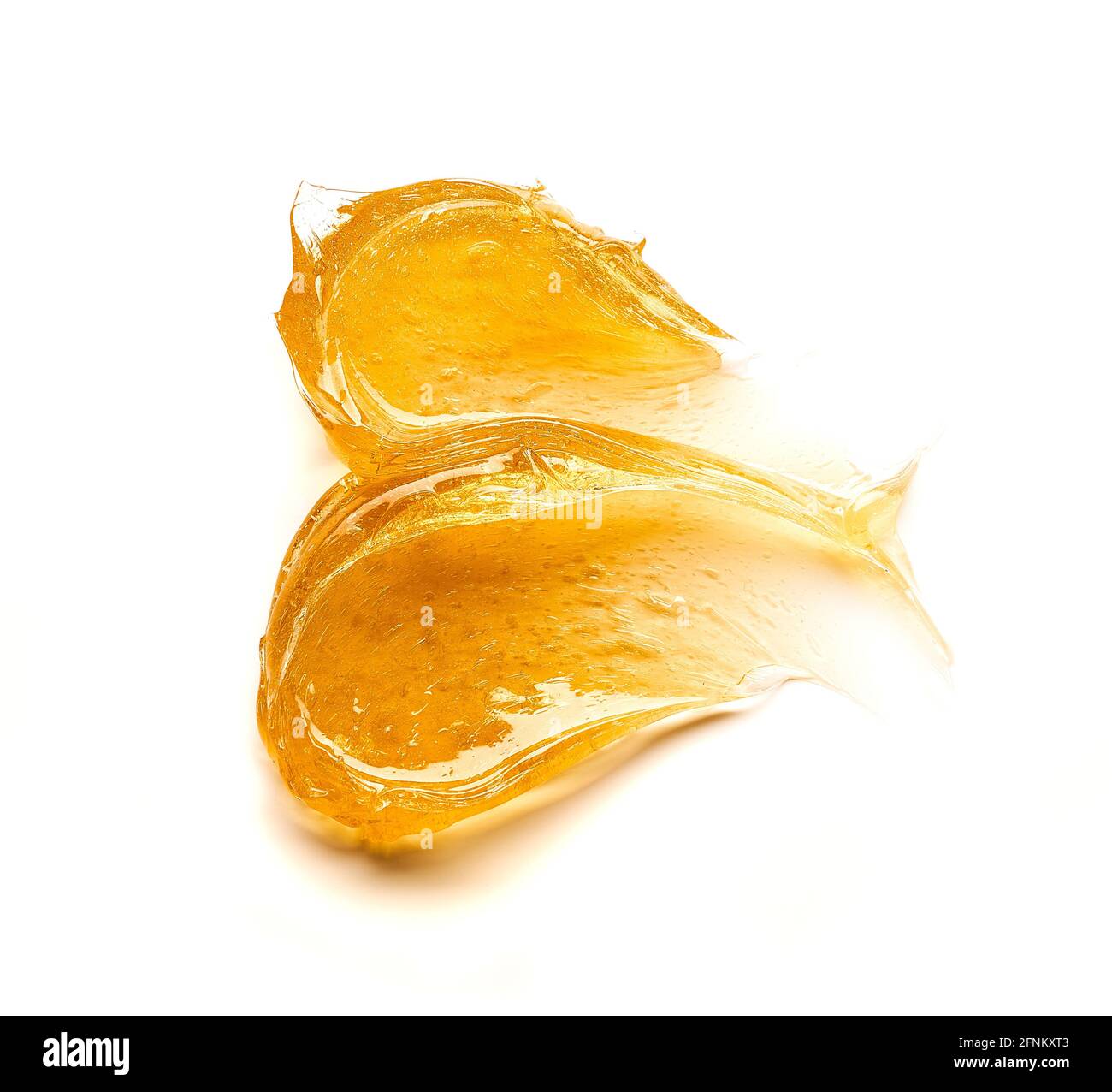 Transparent yellow smear of face cream or golden honey isolated on ...