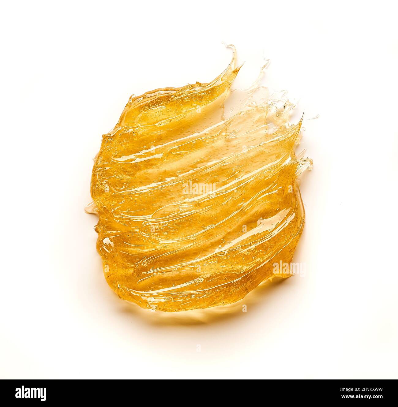 Transparent yellow smear of face cream or golden honey isolated on ...