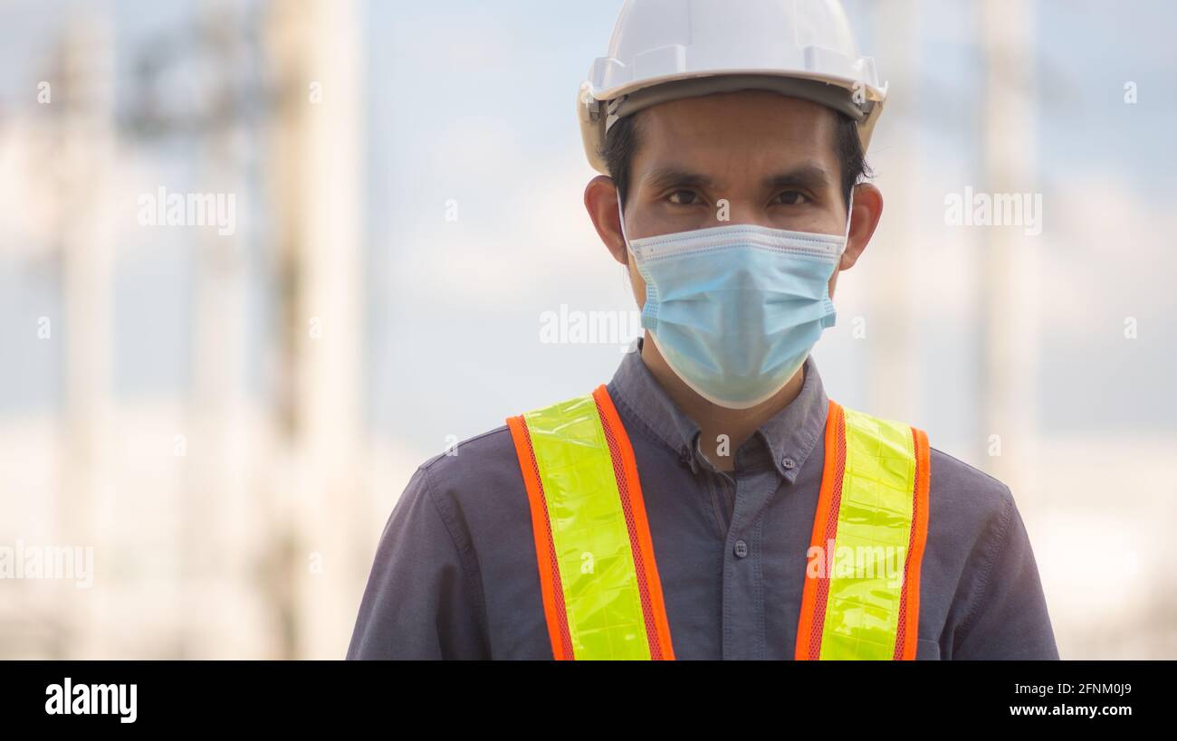 Engineer wear medical mask protect covid19 coronavirus and working ...