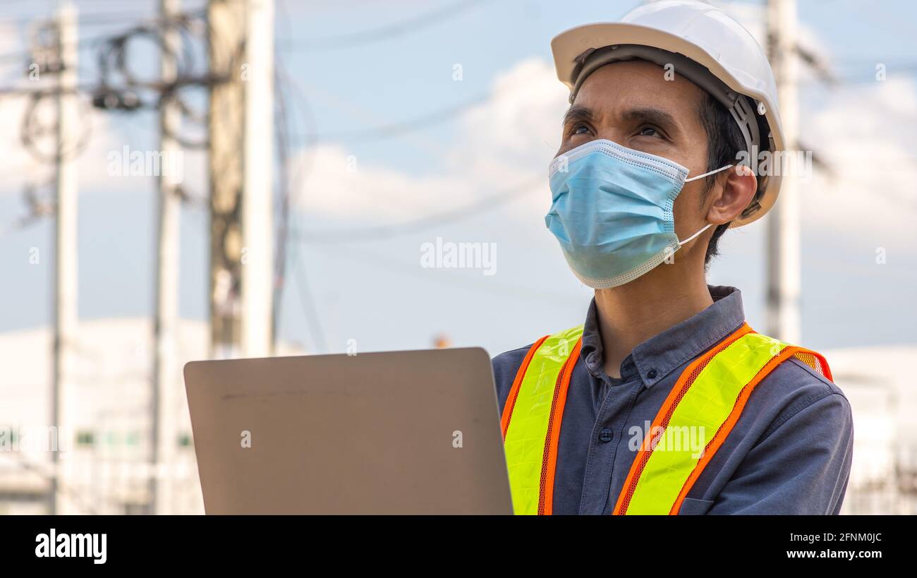 Engineer wear medical mask protect covid19 coronavirus and working ...