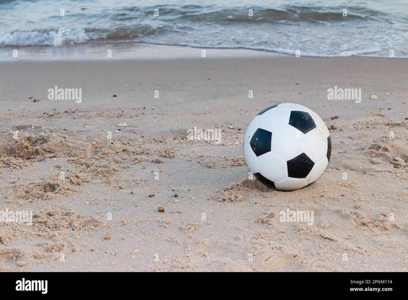 Soccer ball on the sand background Stock Photo - Alamy