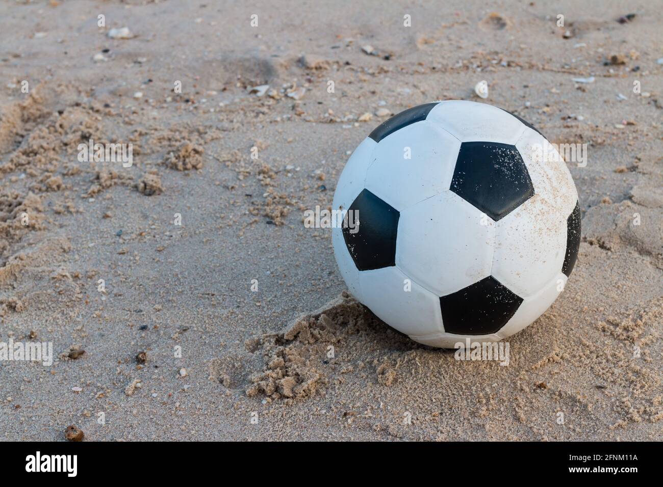 Soccer ball on the sand background Stock Photo - Alamy