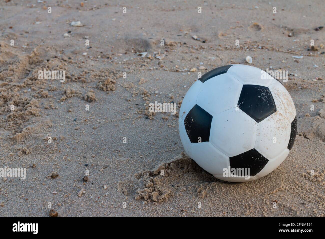 Soccer ball on the sand background Stock Photo - Alamy