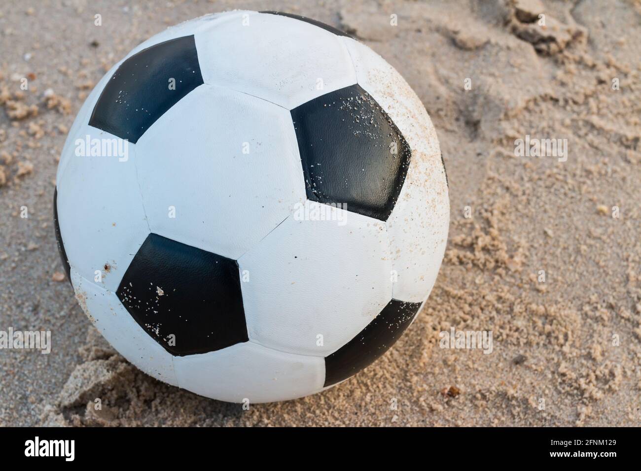Soccer ball on the sand background Stock Photo - Alamy