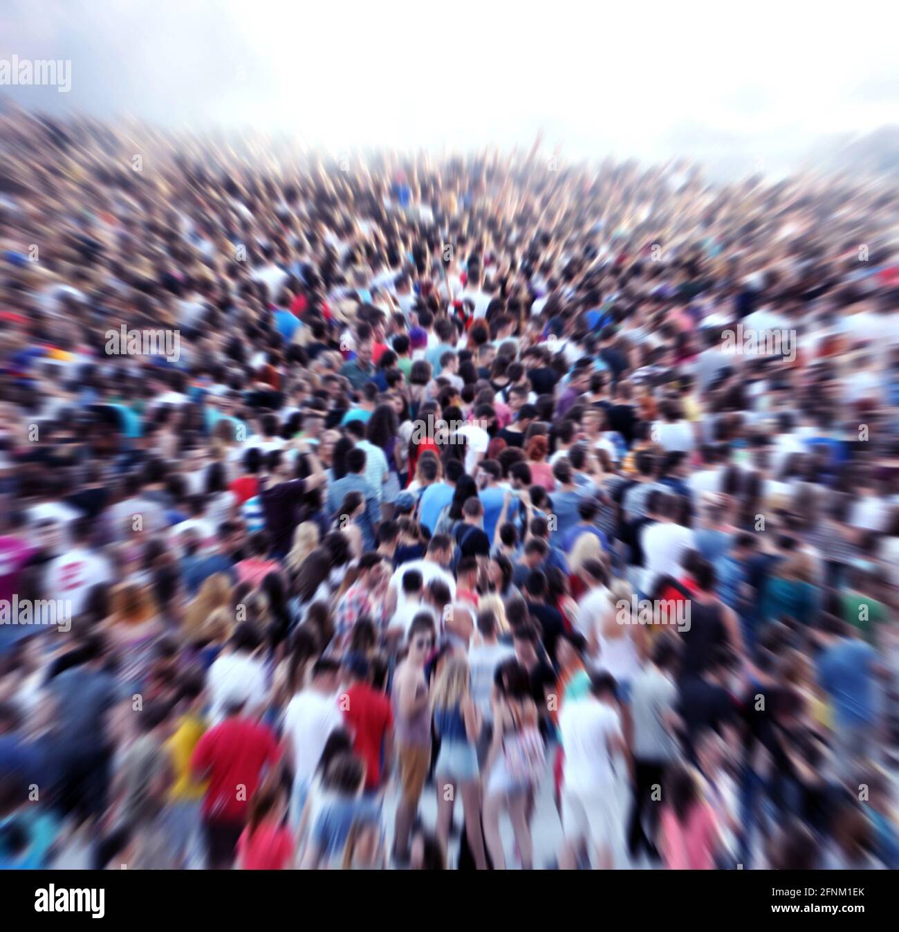 Blurred crowd partying at a music festival. Zoom in and motion blur ...