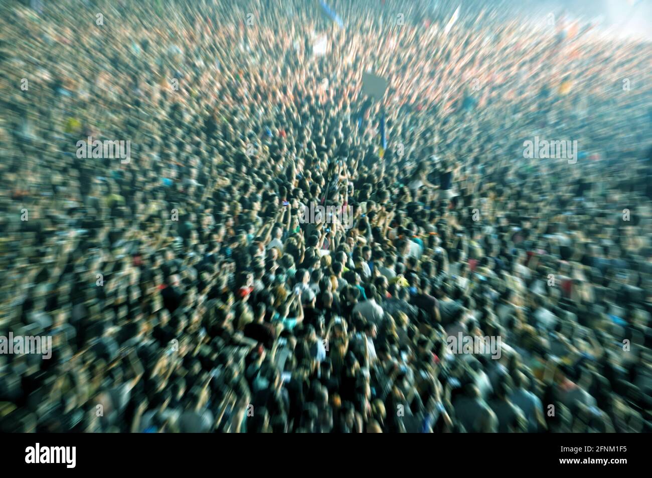 Blurred crowd partying at a music festival. Zoom in effect Stock Photo ...