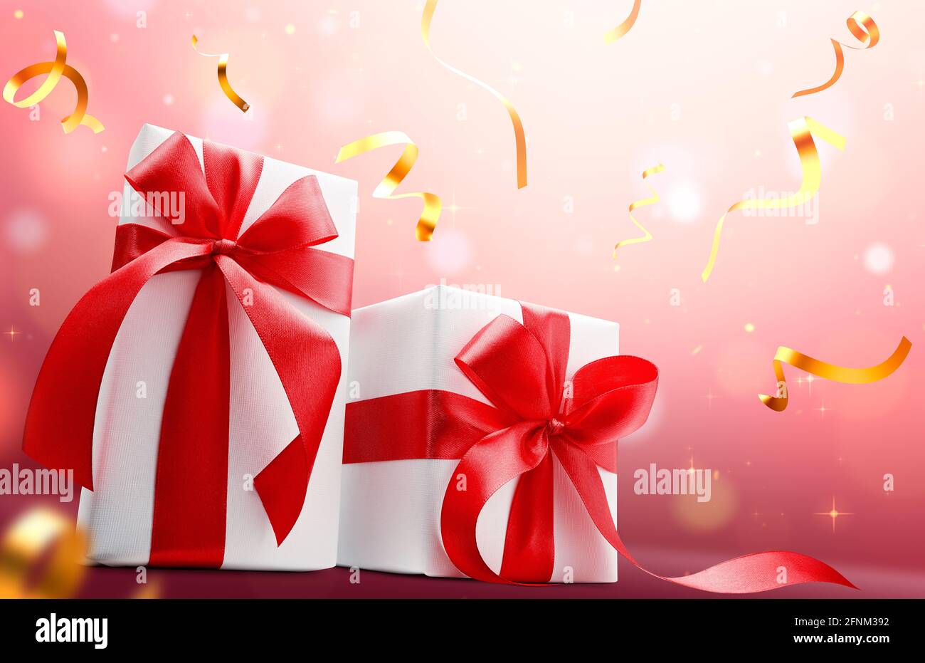 White color gift boxes with ribbons on glittering background Stock ...