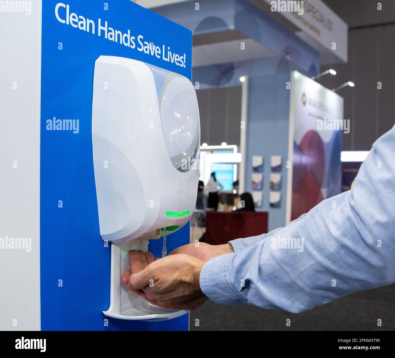 Hand sanitising public hi-res stock photography and images - Alamy